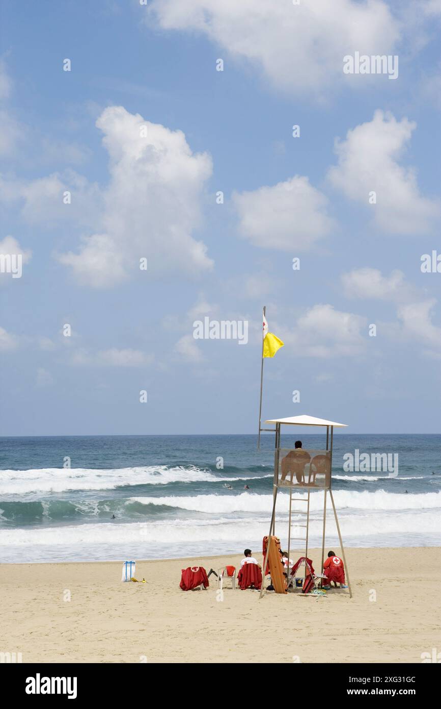 Red Cross lifeguard chair on Zurriola beach, San Sebastian. Guipuzcoa ...