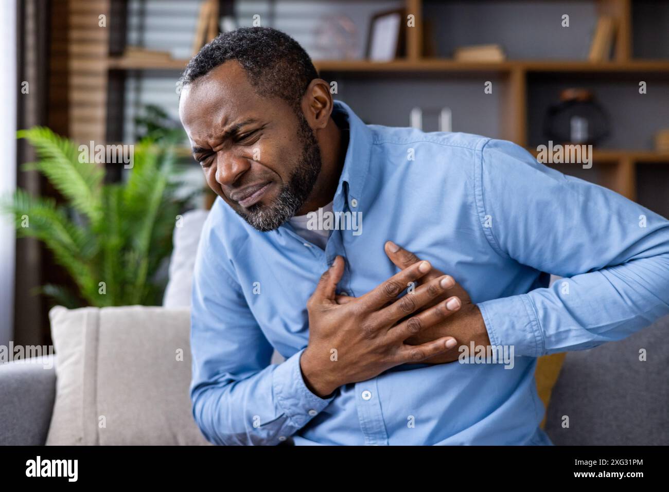 Gripping chest pain hi-res stock photography and images - Alamy