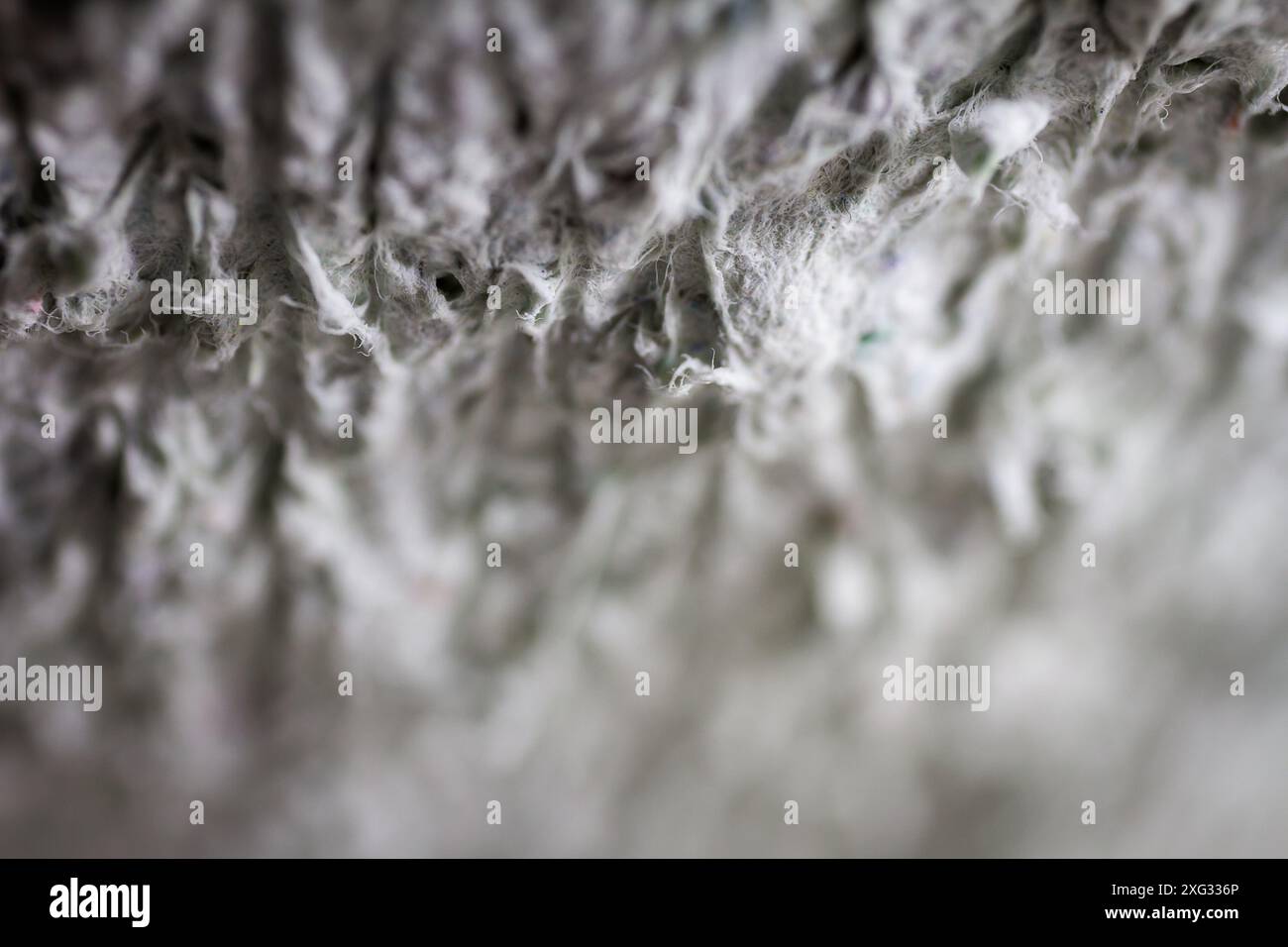 Extreme close up of old gray handmade paper mache with a structure and ...