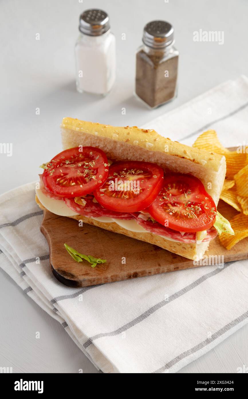 Homemade Italian Sub Sandwich with Salami, Tomatoes and Shredded ...