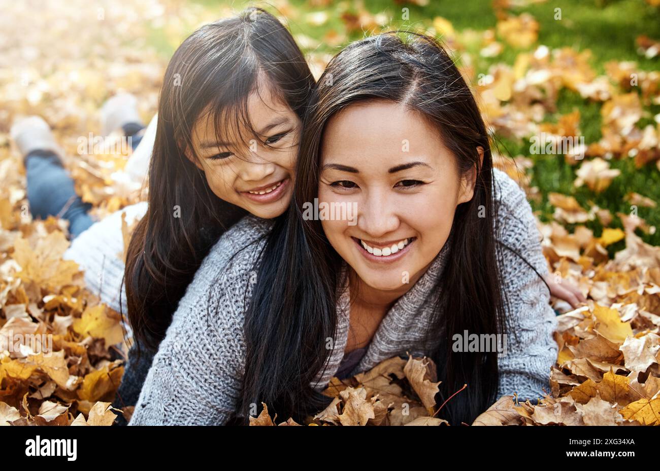 Asian family, mother and girl on floor in backyard for bonding, support ...