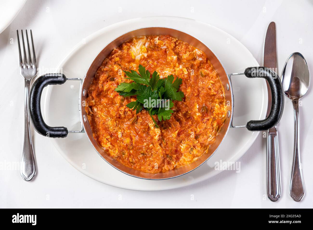 Turkish traditional menemen dish made with eggs, onions, peppers and ...