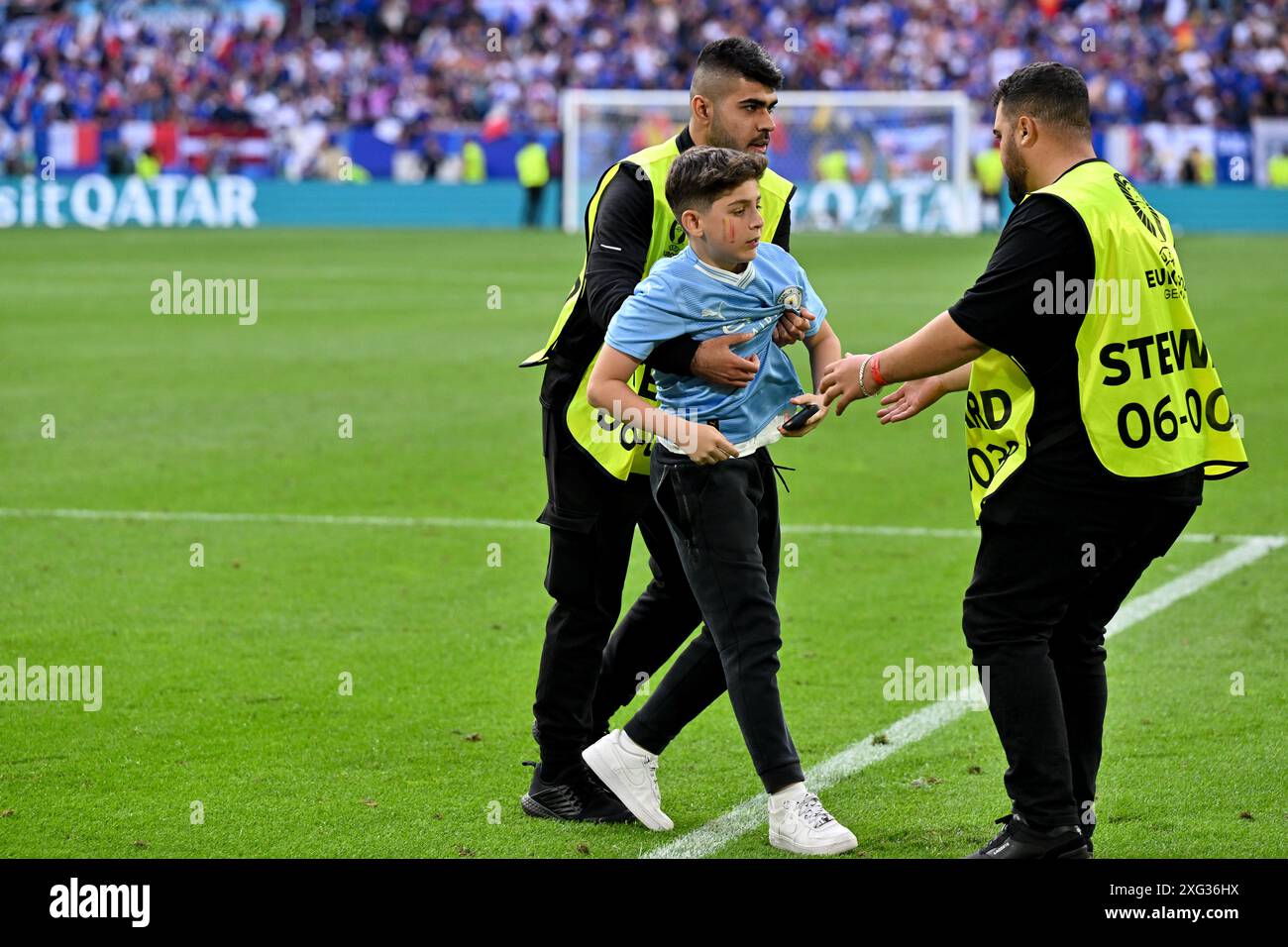 a young fan of Manchester City , pitch invader, streaker wants to take ...
