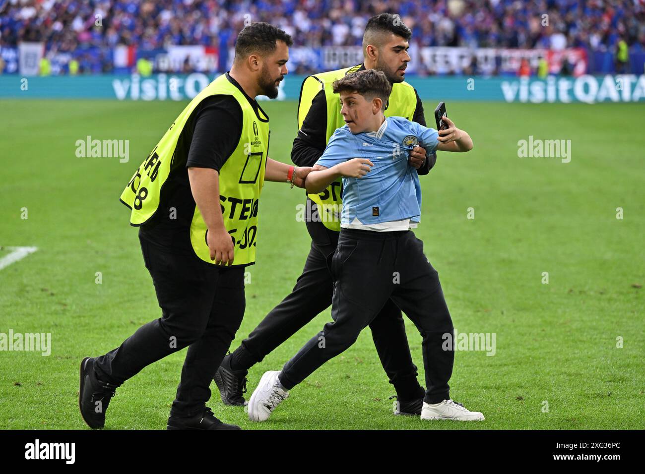 a young fan of Manchester City , pitch invader, streaker wants to take ...