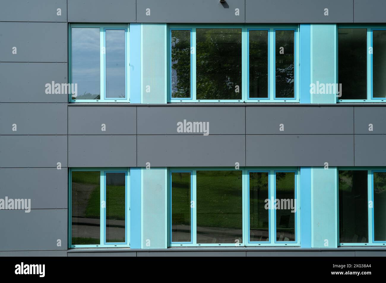 modern office building with blue-green windows Stock Photo - Alamy