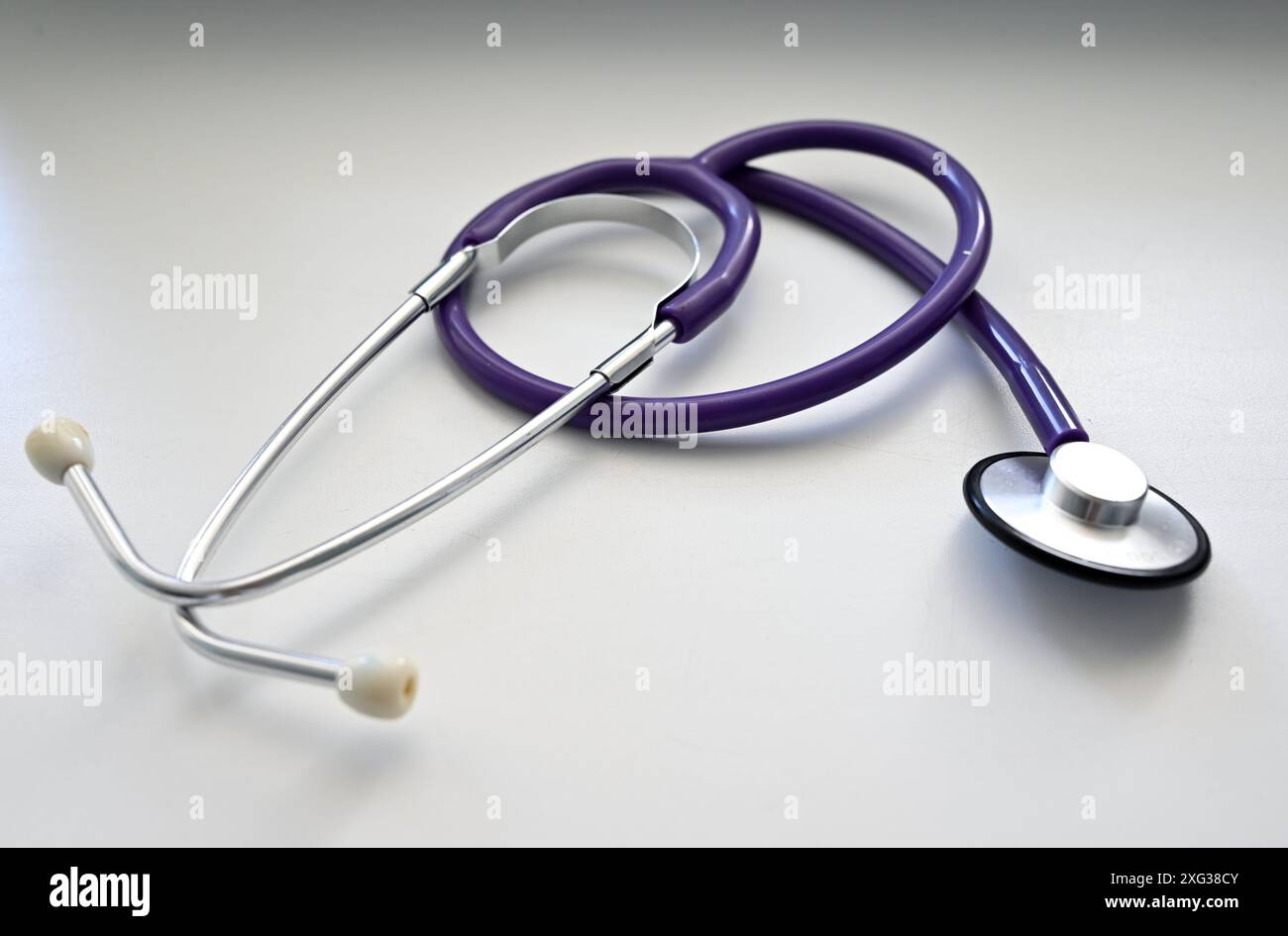 photo with a rolled up medical purple phonendoscope for auscultation of ...