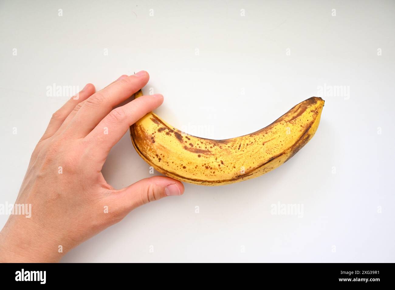 Banana with ripening spots hi-res stock photography and images - Alamy