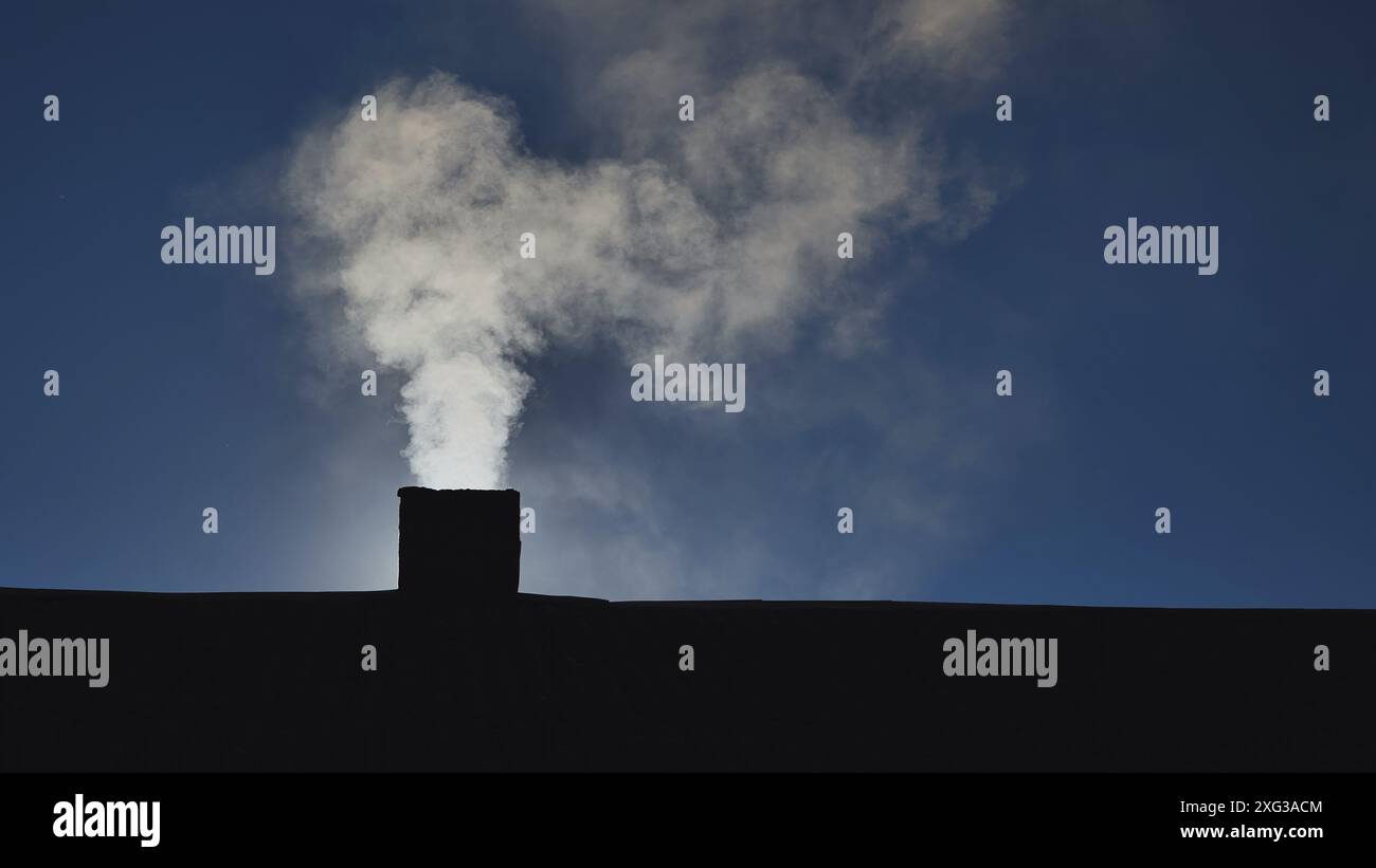 Smoke from chimney home sunset hi-res stock photography and images - Alamy