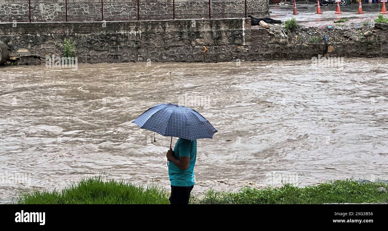 July 6, 2024: A man walks at the bank of river after the heavy rainfall ...
