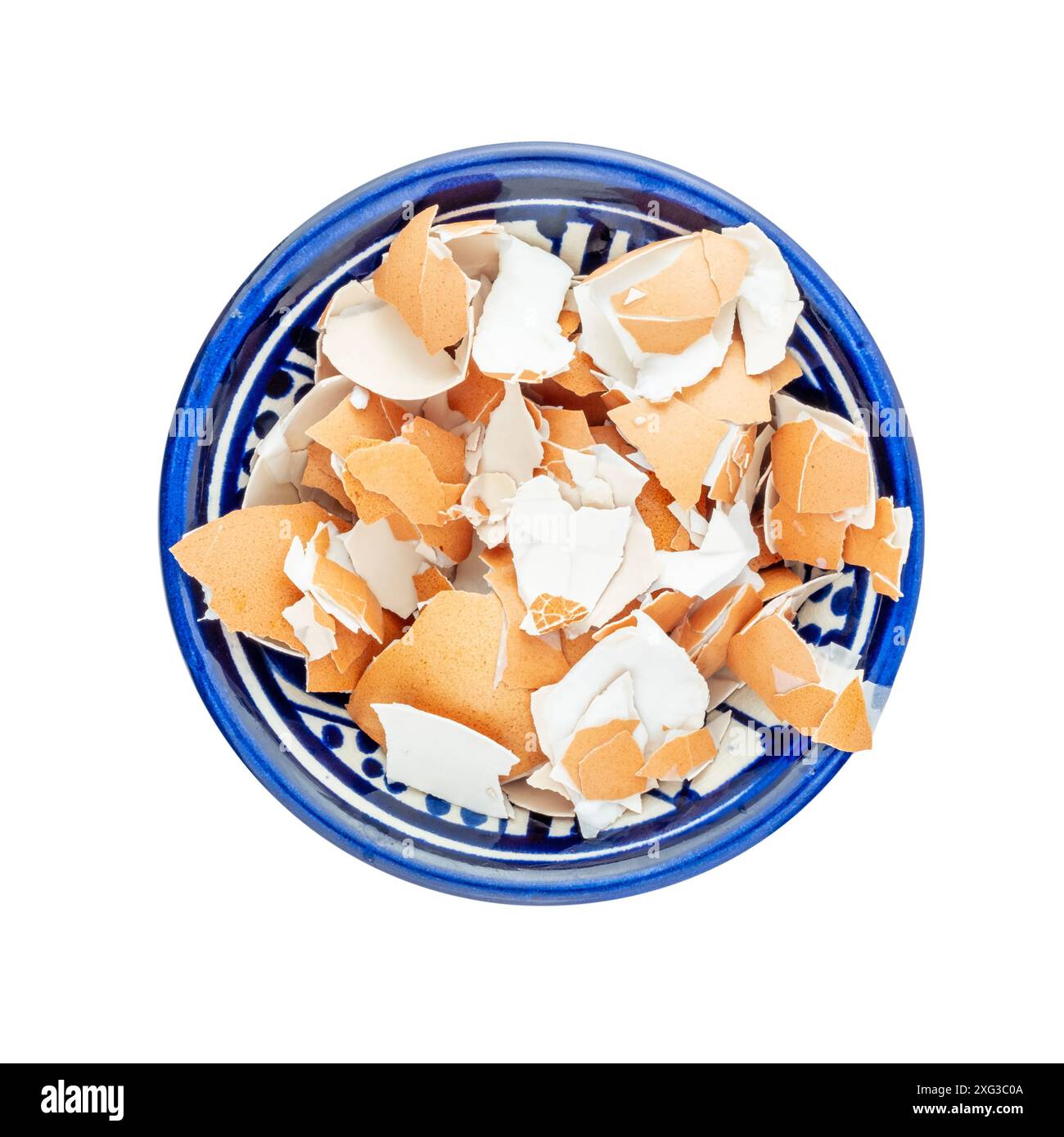 Pile of broken eggshell in a round bowl isolated on white background ...