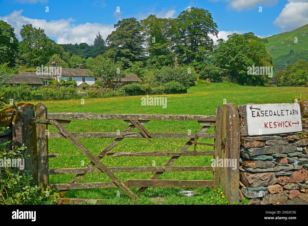 White farm building Grasmere village in the Lake District National Park ...
