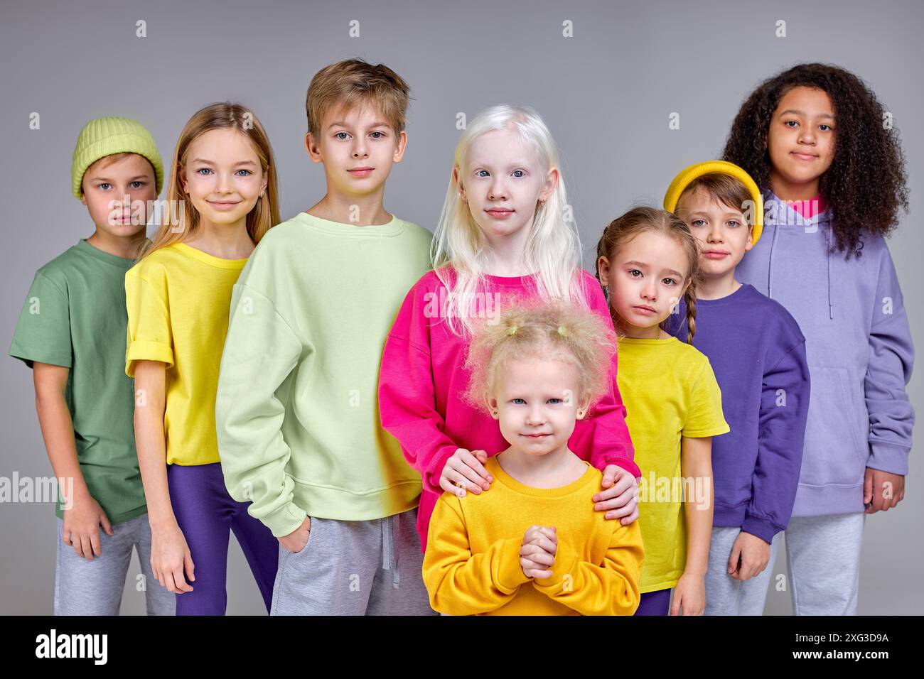 Group of children standing together, showing their unity, kids are ...