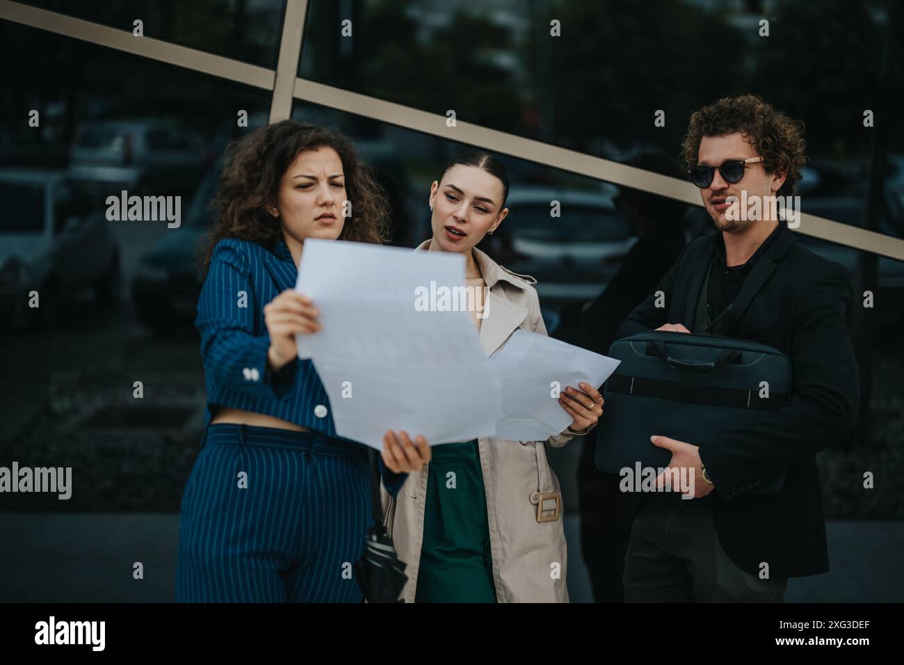 Group business professionals reviewing paperwork hi-res stock ...