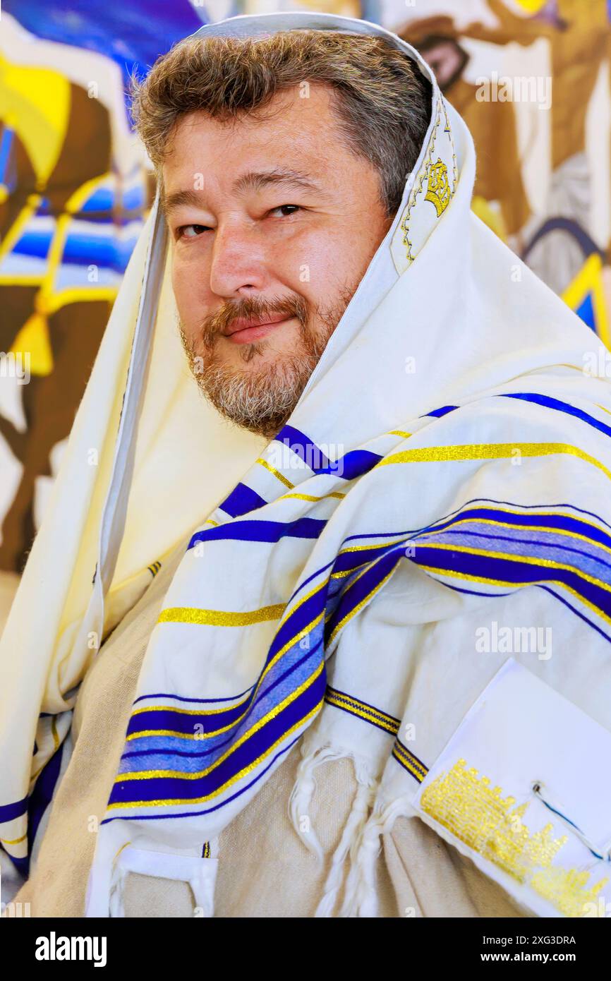 Rabbi wearing traditional Jewish clothing in synagogue during prayer ...