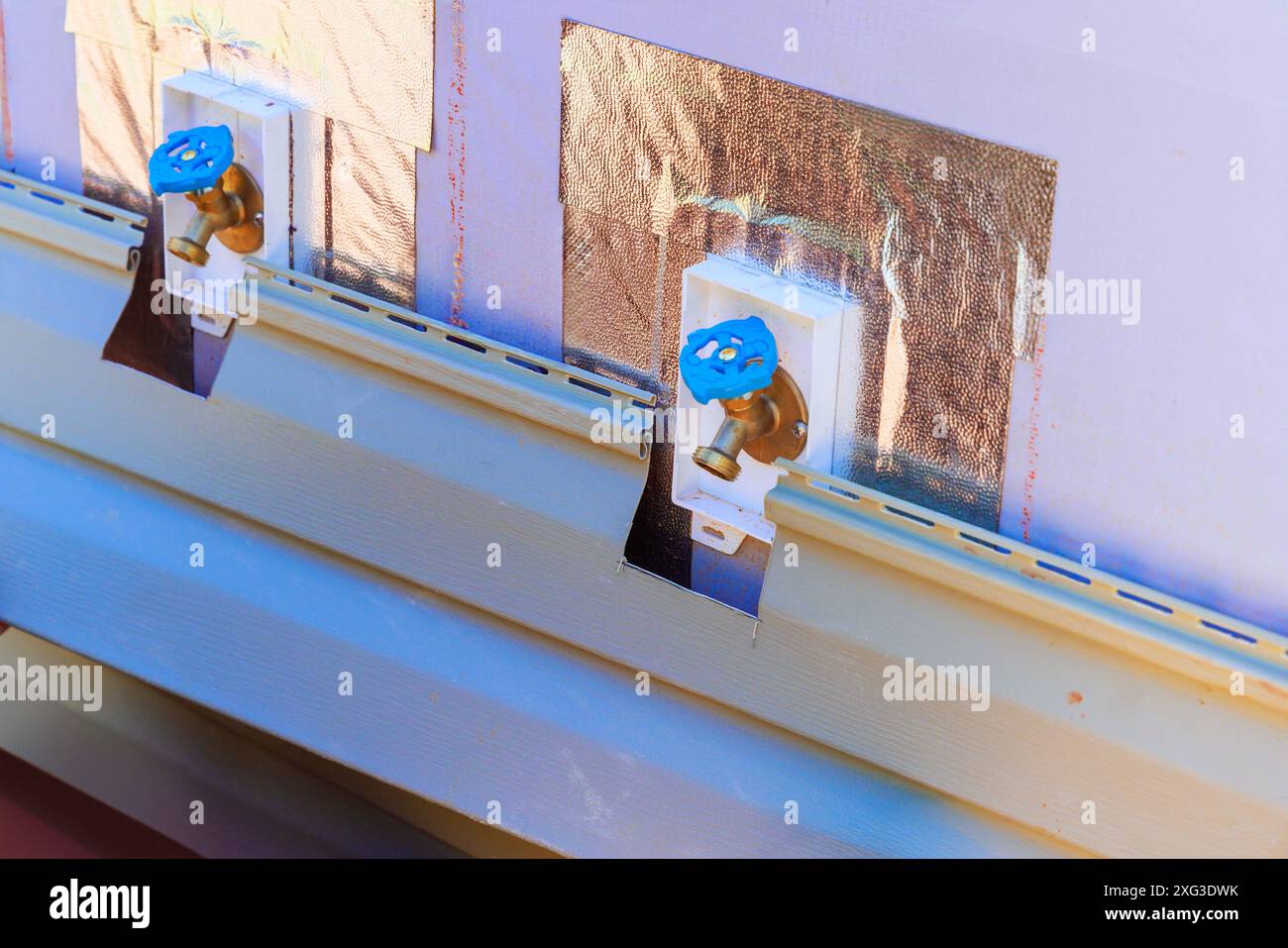 Installing vinyl plastic siding panels on house wall facade Stock Photo ...