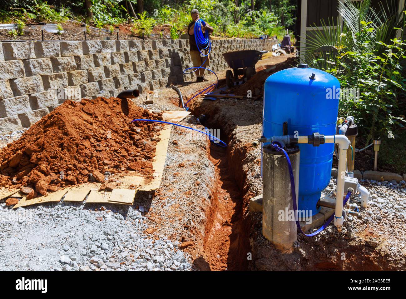 An underground trench with PVC pipe is ready for connection to well ...