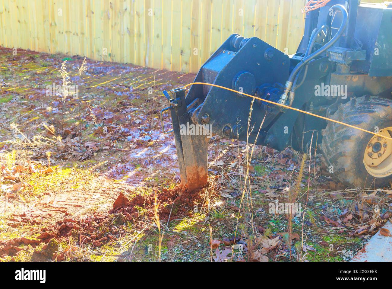 Laying fiber optic cables using trencher cable plow tractors Stock ...