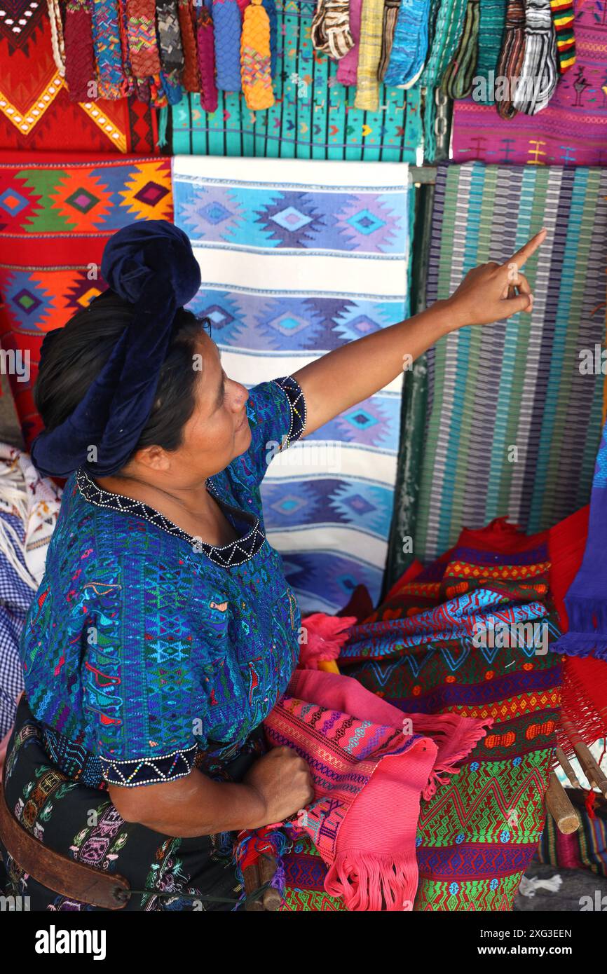 Indigenous Guatemalan lady selling her colourful hand woven wares by ...