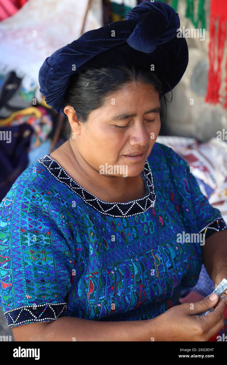 Indigenous Guatemalan lady selling her colourful hand woven wares by ...