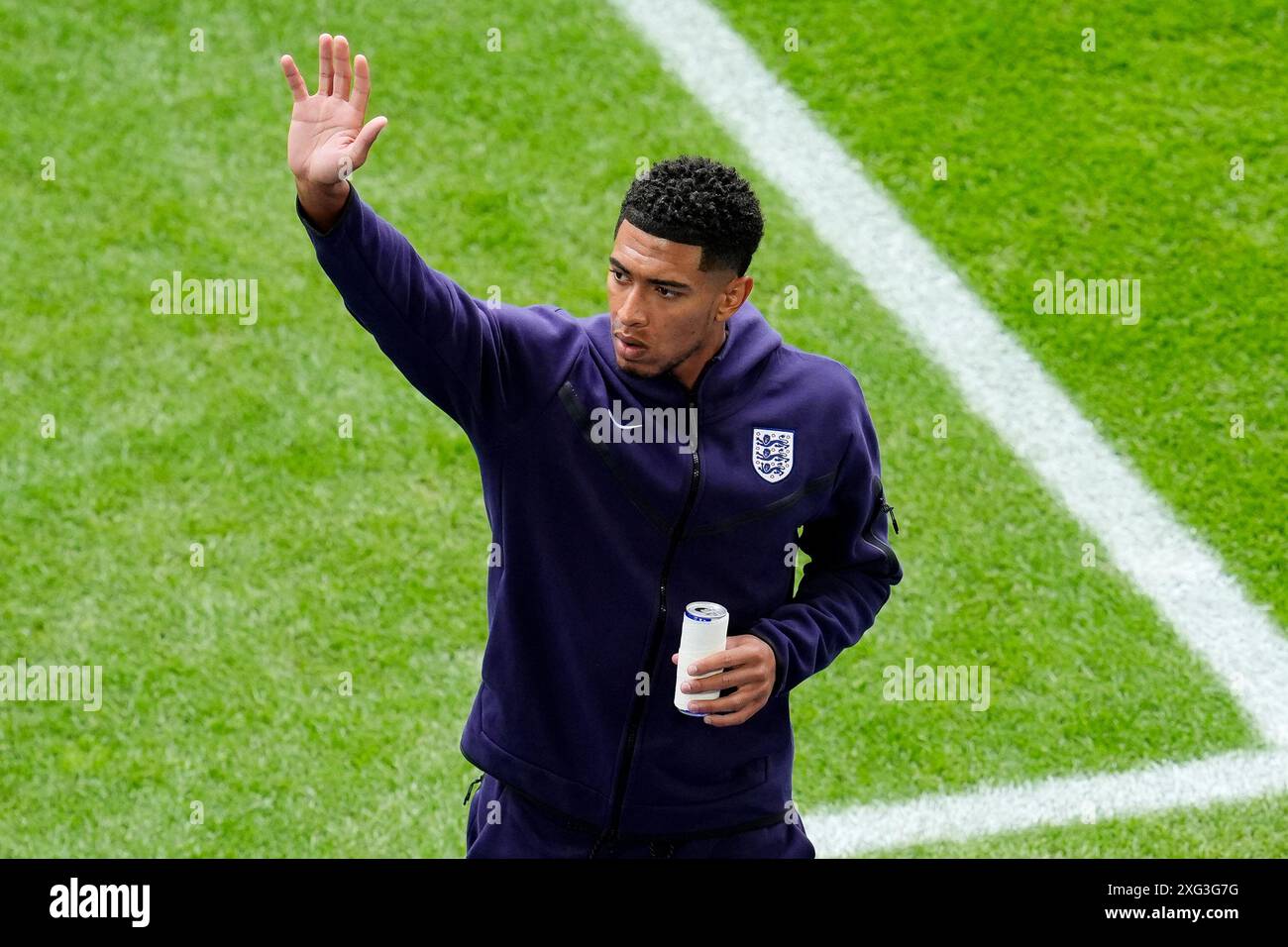 England's Jude Bellingham gestures as he inspects the pitch ahead of ...