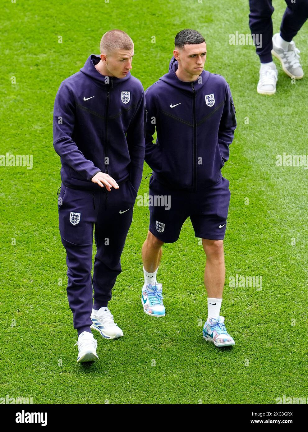 England's Adam Wharton (left) and Phil Foden inspect the pitch ahead of ...