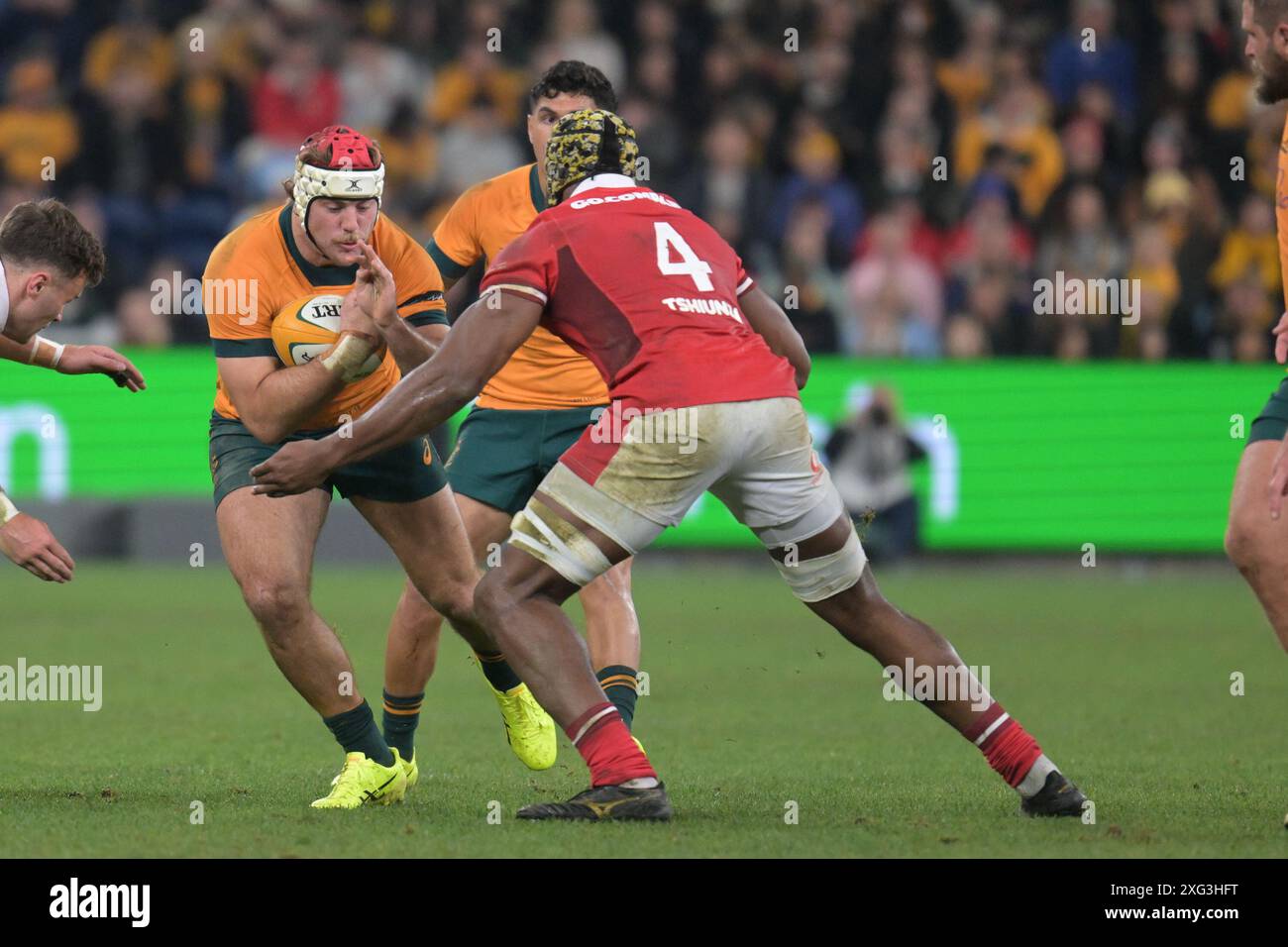 Mason Grady (L), Christ Tshiunza (R) of Wales men rugby team and Fraser ...