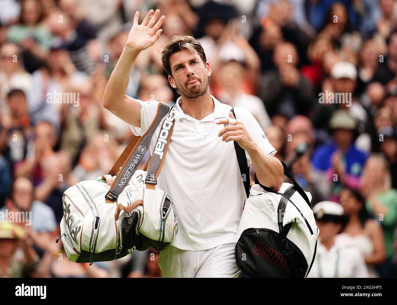 Cameron Norrie looks dejected following his defeat to Alexander Zverev ...