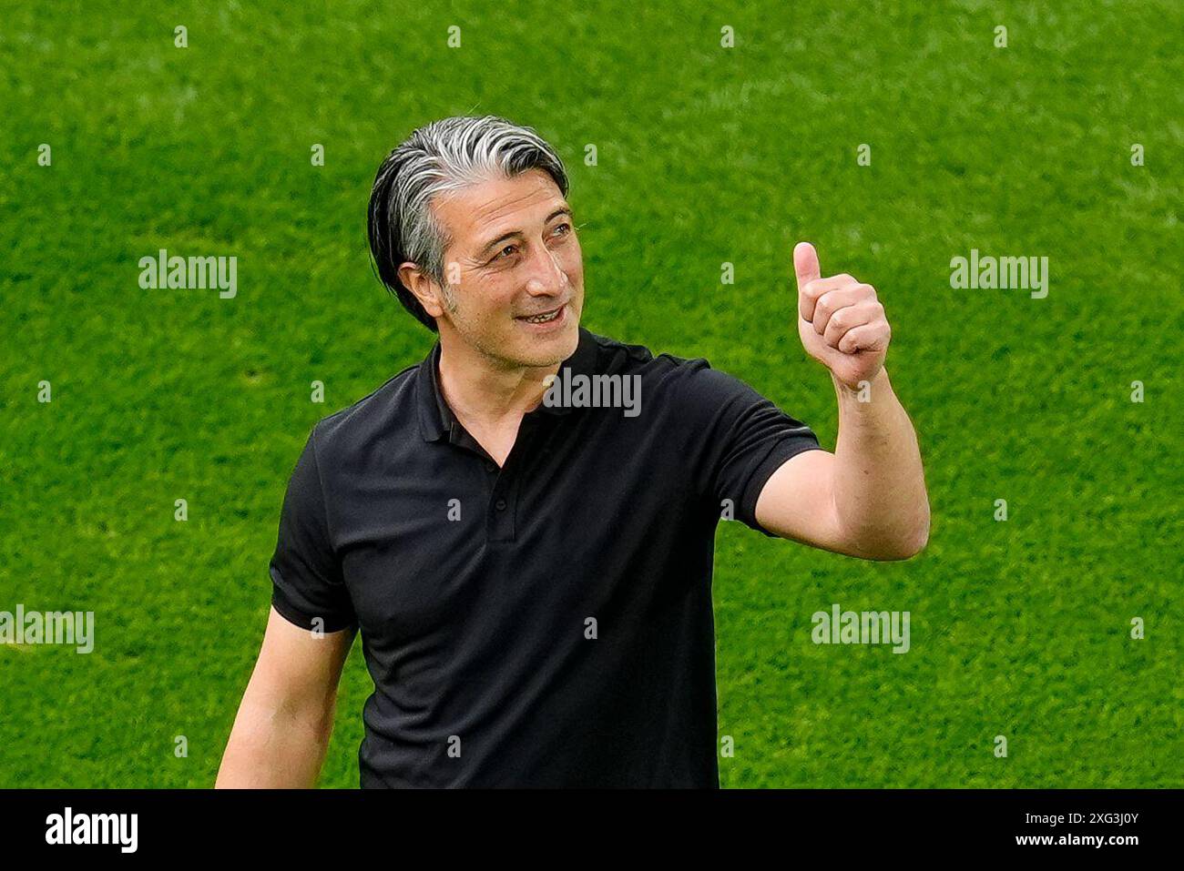 Switzerland manager Murat Yakin gestures towards the fans ahead of the ...