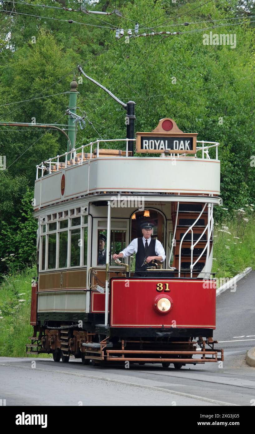 Tram with rails in street at beamish Stock Photo - Alamy