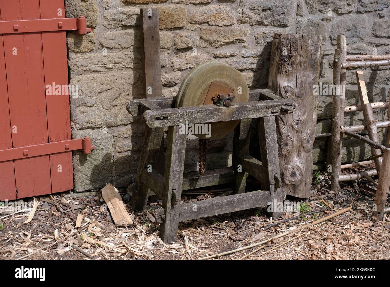 Beamish museum, Durham, UK. Large tool sharpening stone wheel in farm ...