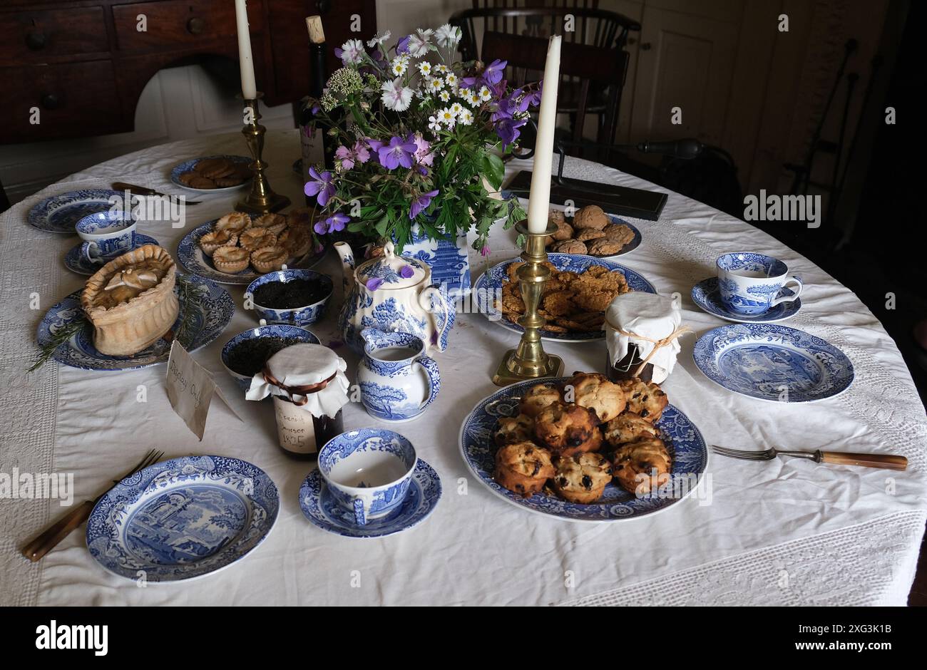 Dining table set with blue and white pots in museum Stock Photo - Alamy
