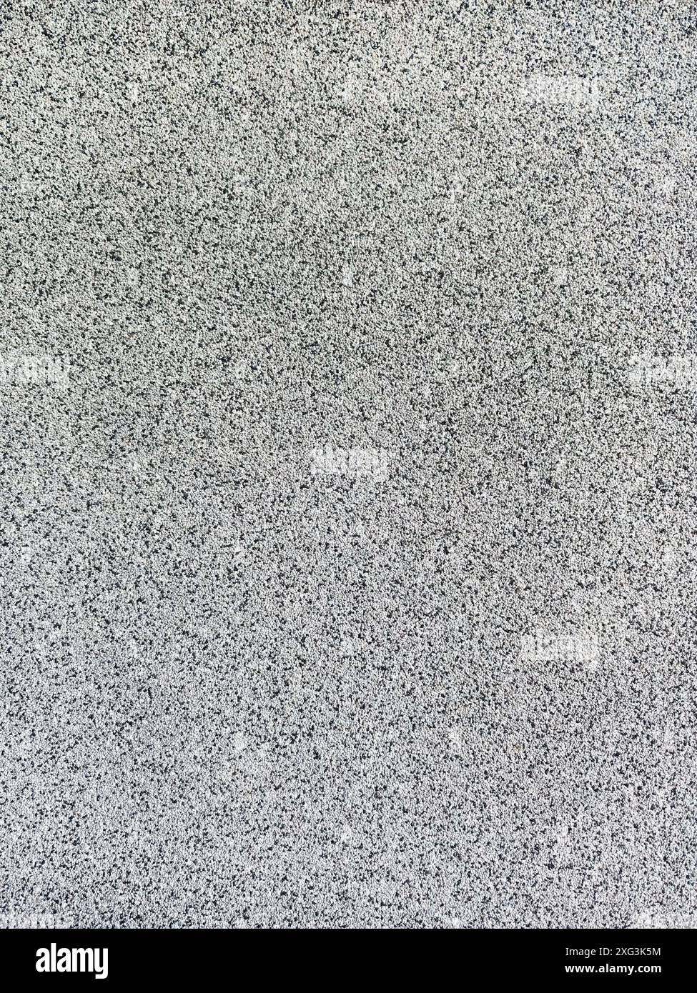 close-up texture shot of a rough, grey surface reminiscent of concrete ...