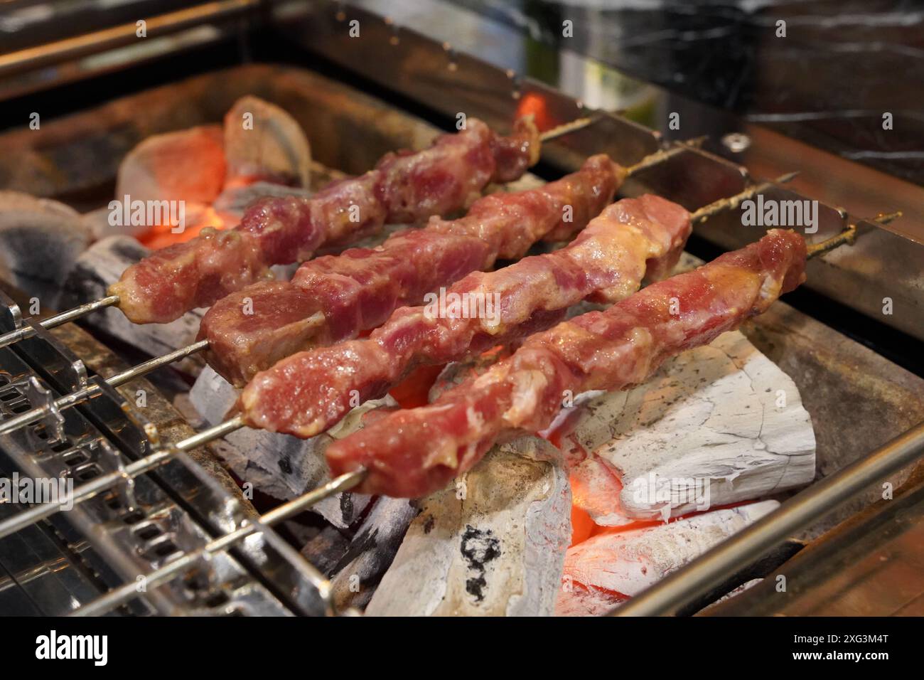 Grilled lamb skewers grilled over charcoal fire Stock Photo - Alamy