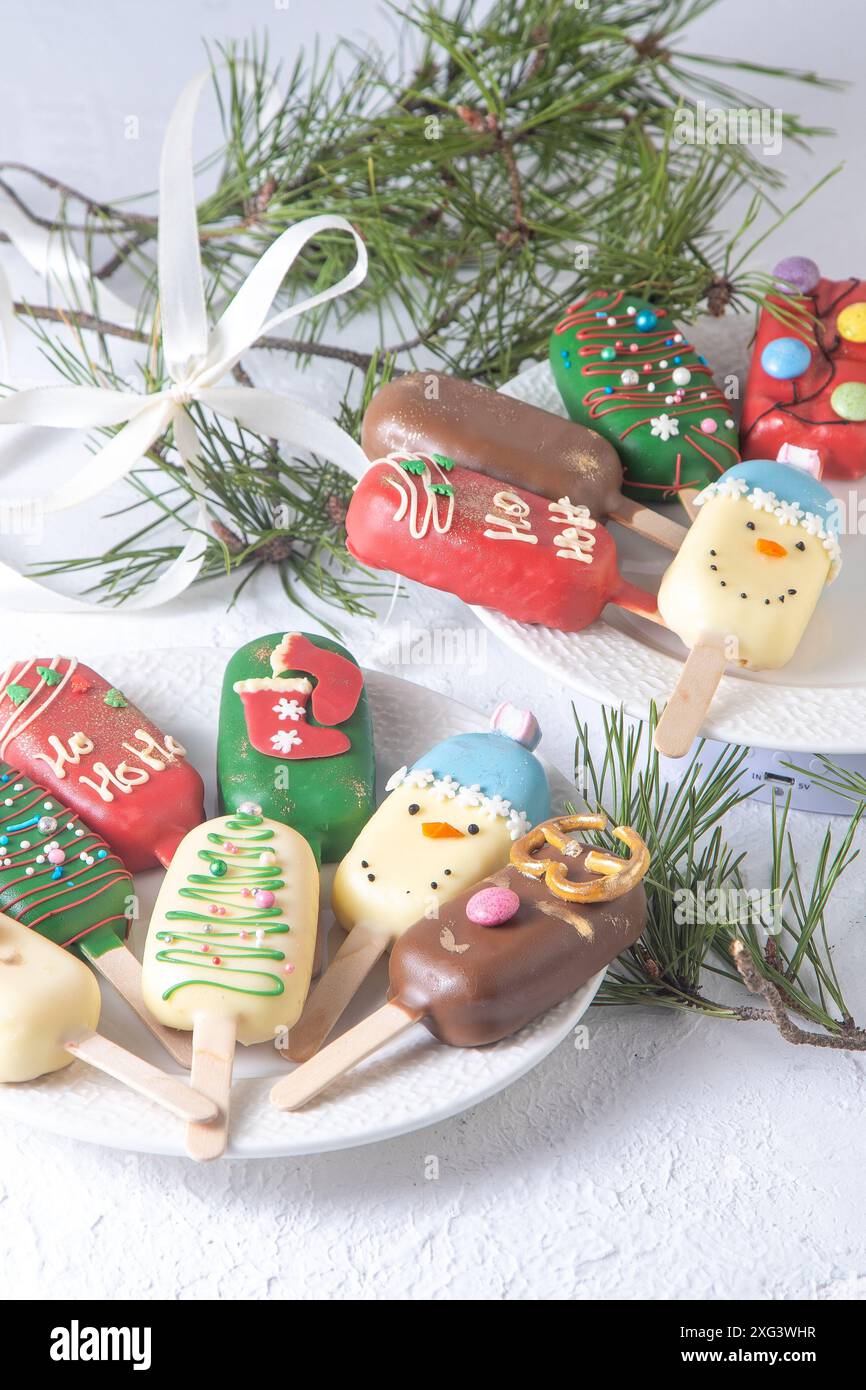 Winter sweet food. Cheesecake stick ice cream. Candy snowman, deer ...