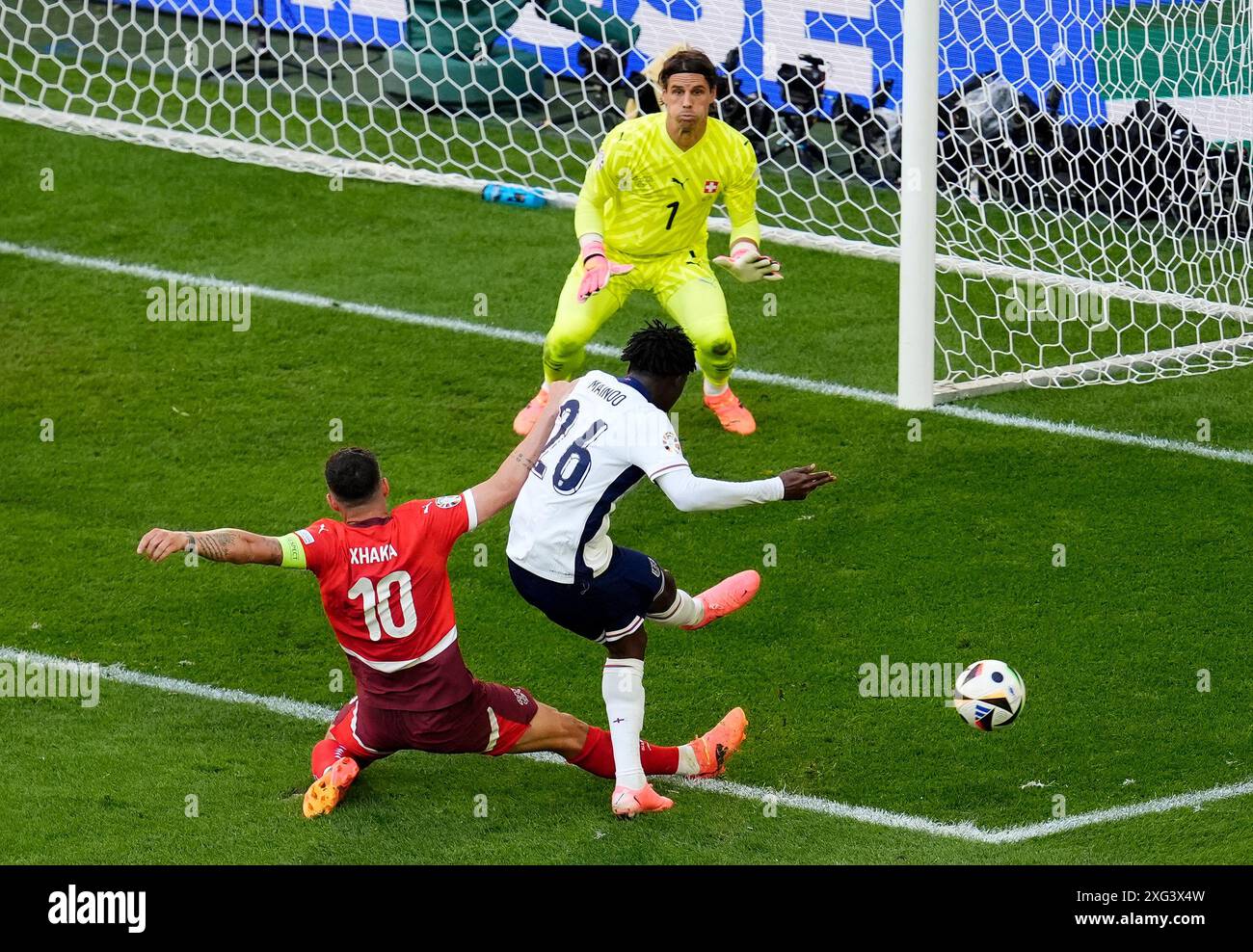 England's Kobbie Mainoo attempts a shot on goal under pressure from ...