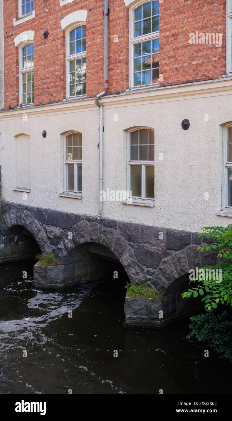 Water flows under a building Stock Photo - Alamy