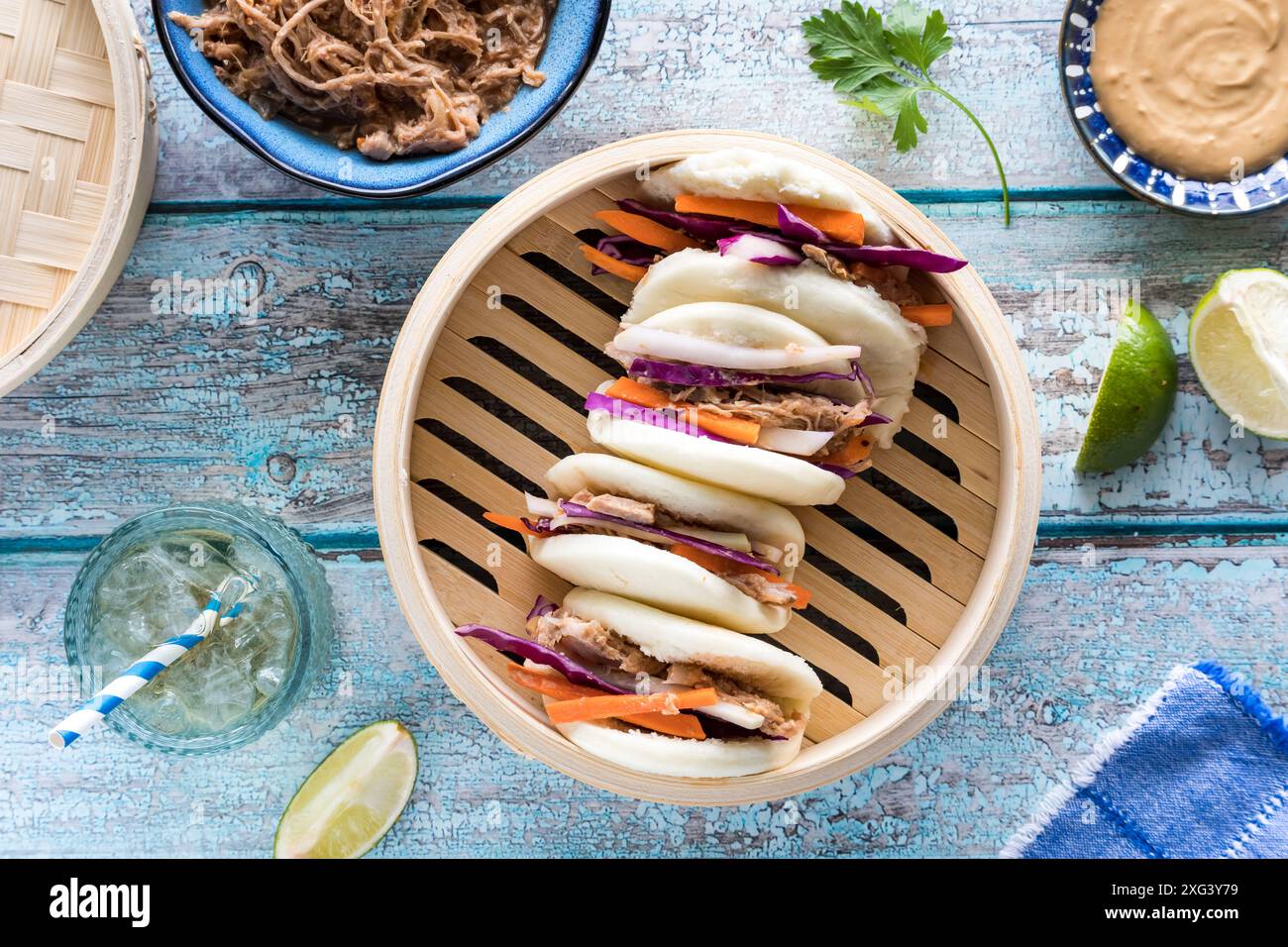 Pulled pork stuffed and steamed bao buns in a steamer, ready for eating ...