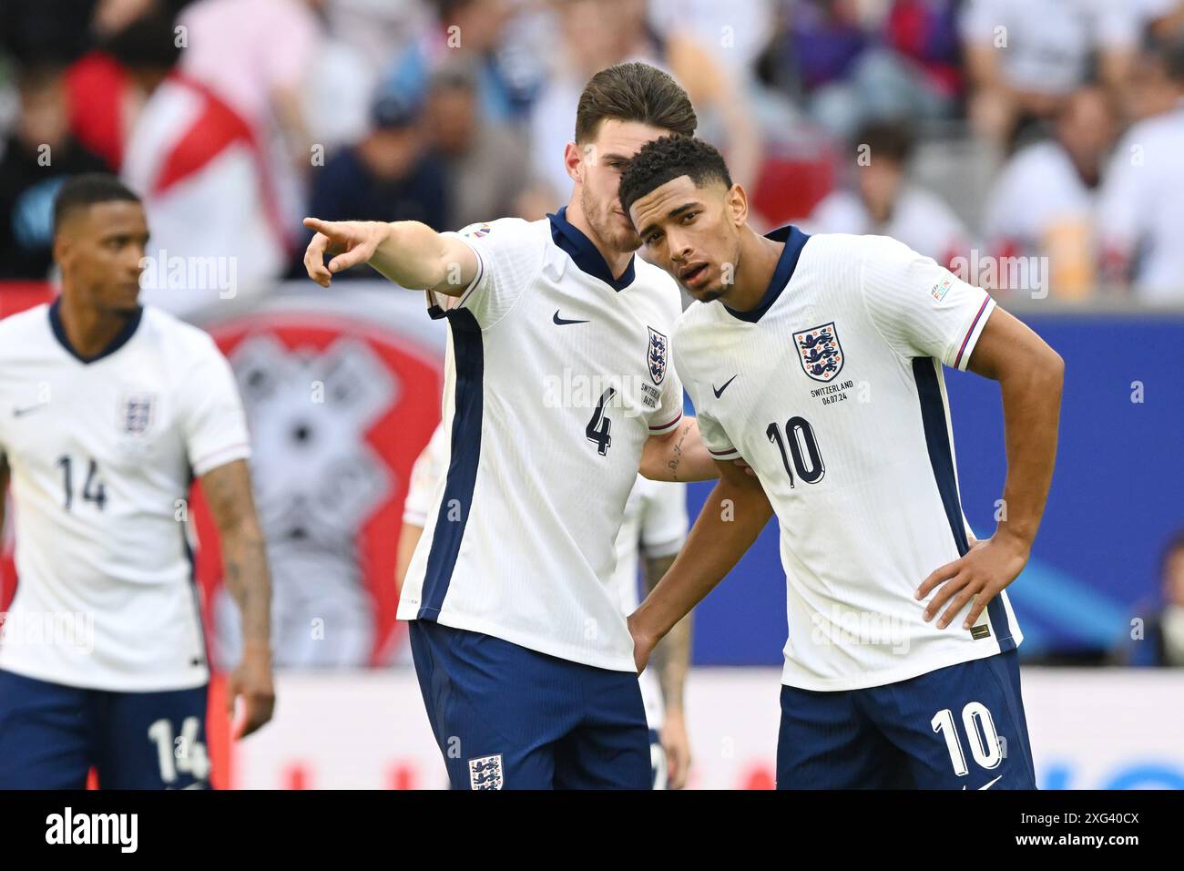 DUSSELDORF - 06/07/2024, (l-r) Ezri Konsa of England, Declan Rice of England, Jude Bellingham of ...