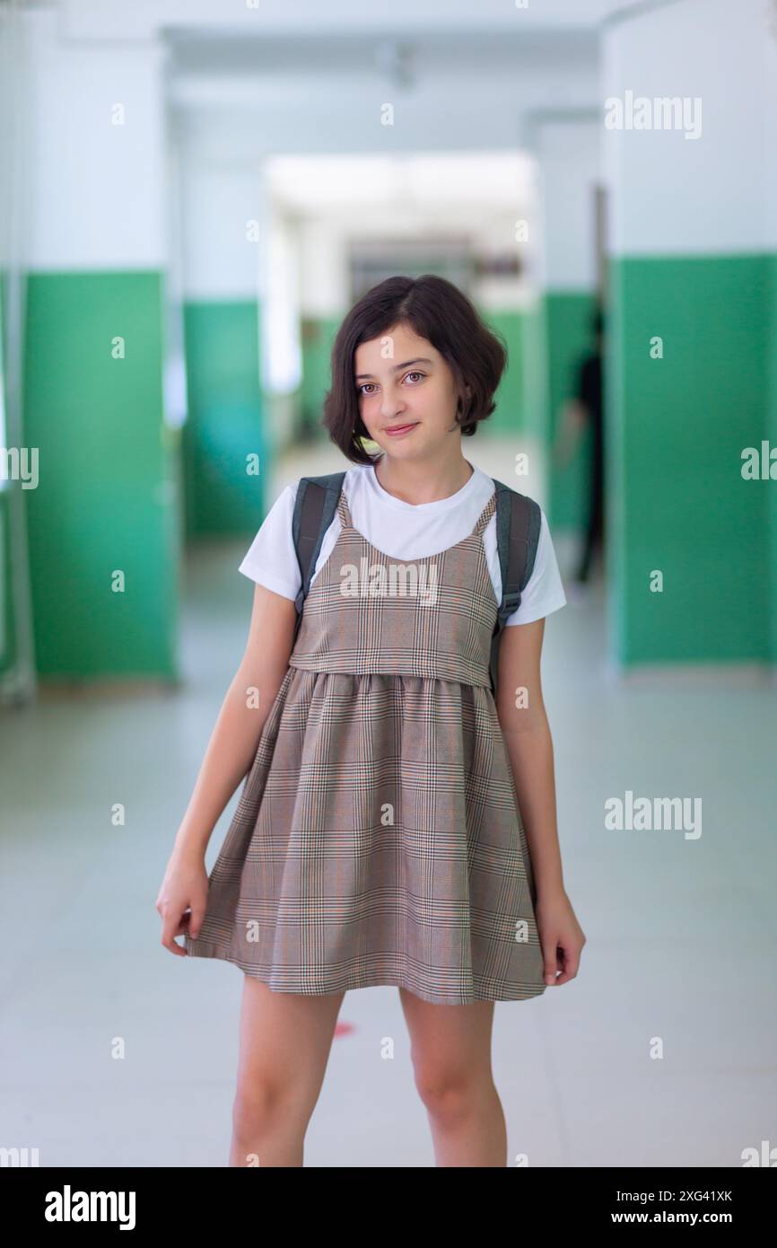 Beautiful girl in a school corridor posing for the camera Stock Photo ...
