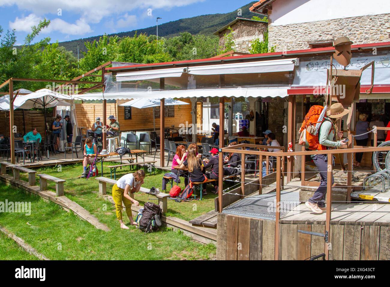 Pilgrims taking a break stopped for food at a cafe on the Camino de ...