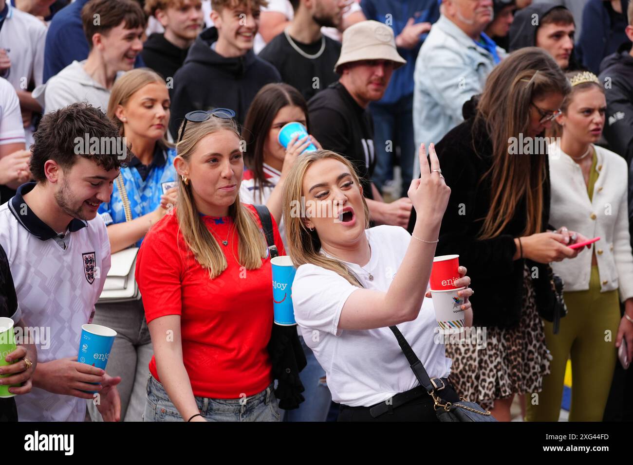 NOTE HAND GESTURE England fans react at Millennium Square in Leeds ...