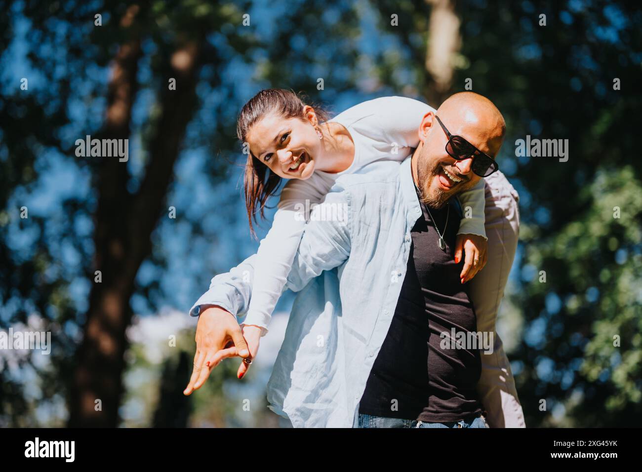 Woman riding on mans back hi-res stock photography and images - Alamy