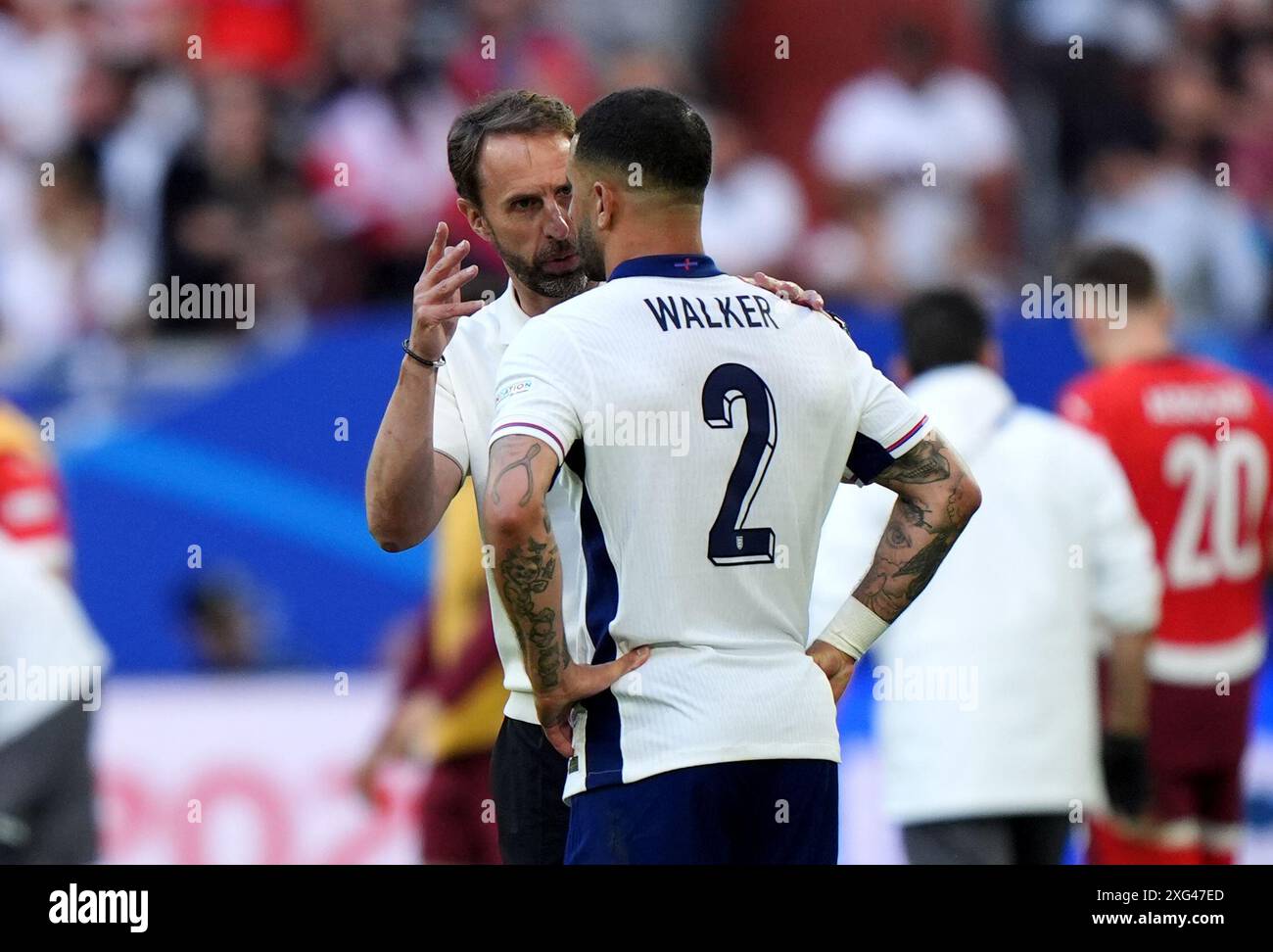 England manager Gareth Southgate (left) speaks with England's Kyle ...