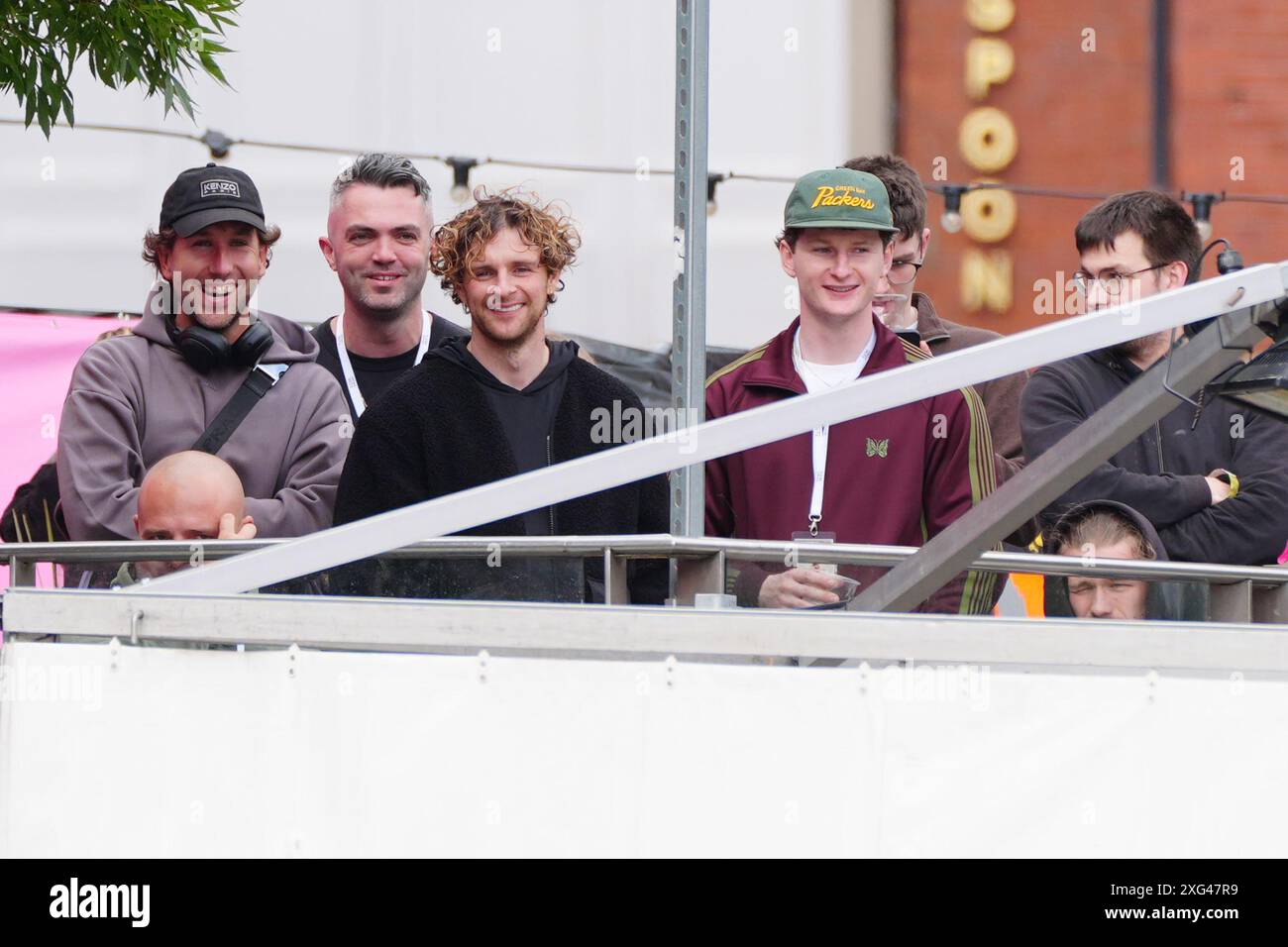 Singer Tom Grennan (third left) in Millennium Square in Leeds during a ...