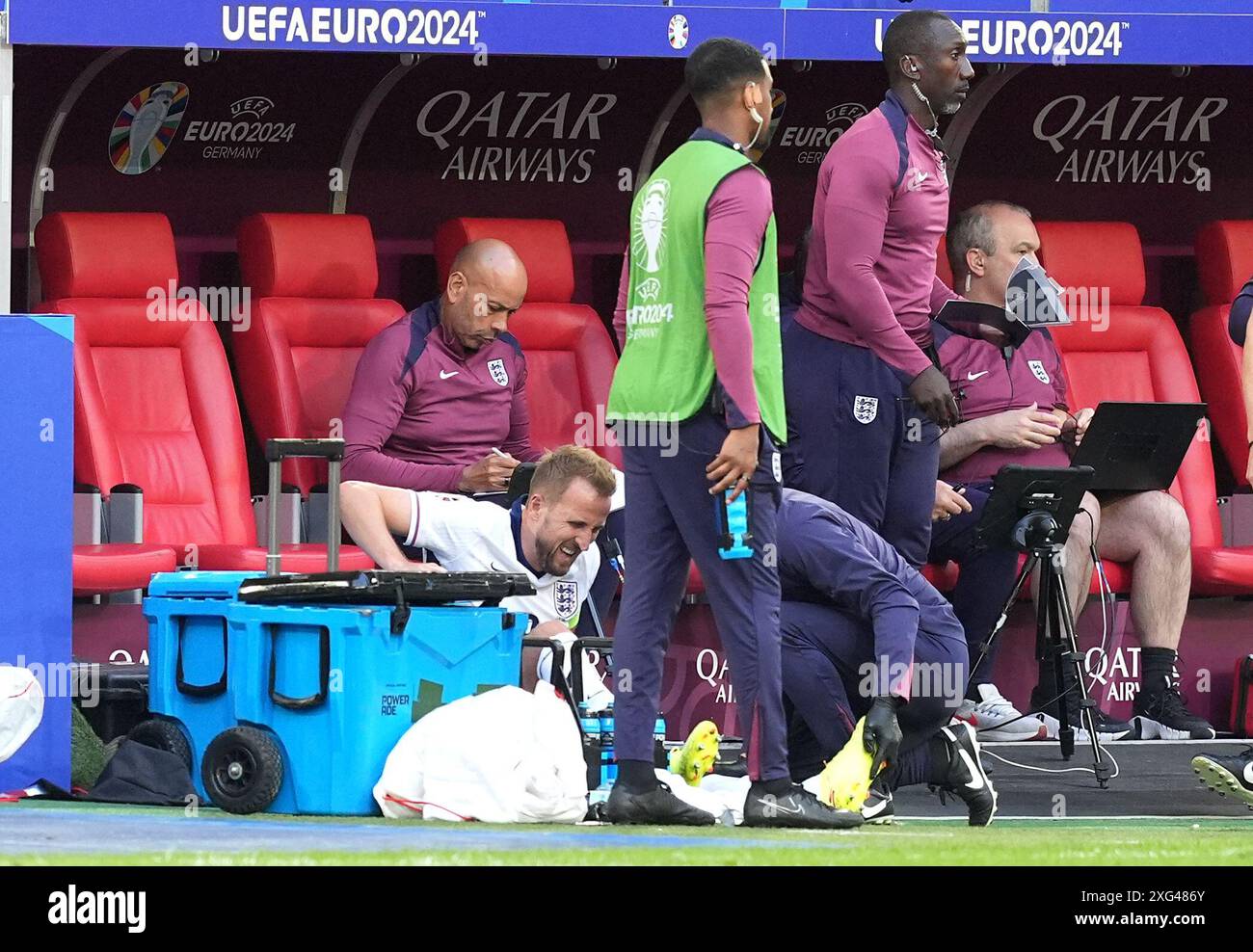 England's Harry Kane after colliding into the England dugout during the ...