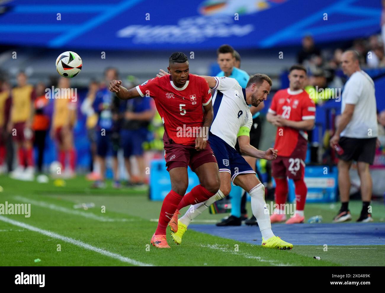 Switzerland's Manuel Akanji (left) and England's Harry Kane battle for ...