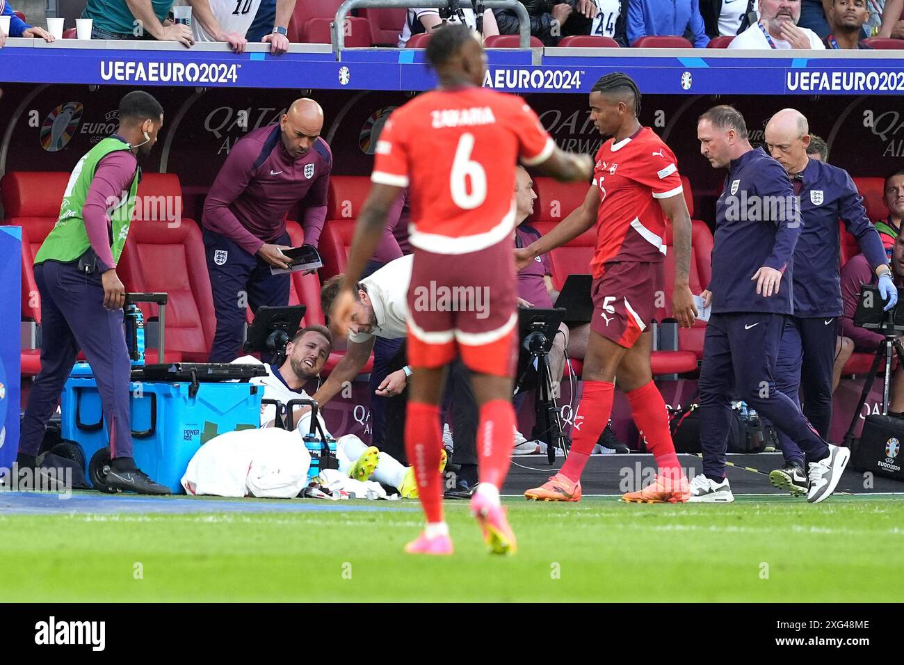 England's Harry Kane receives treatment after colliding into the ...