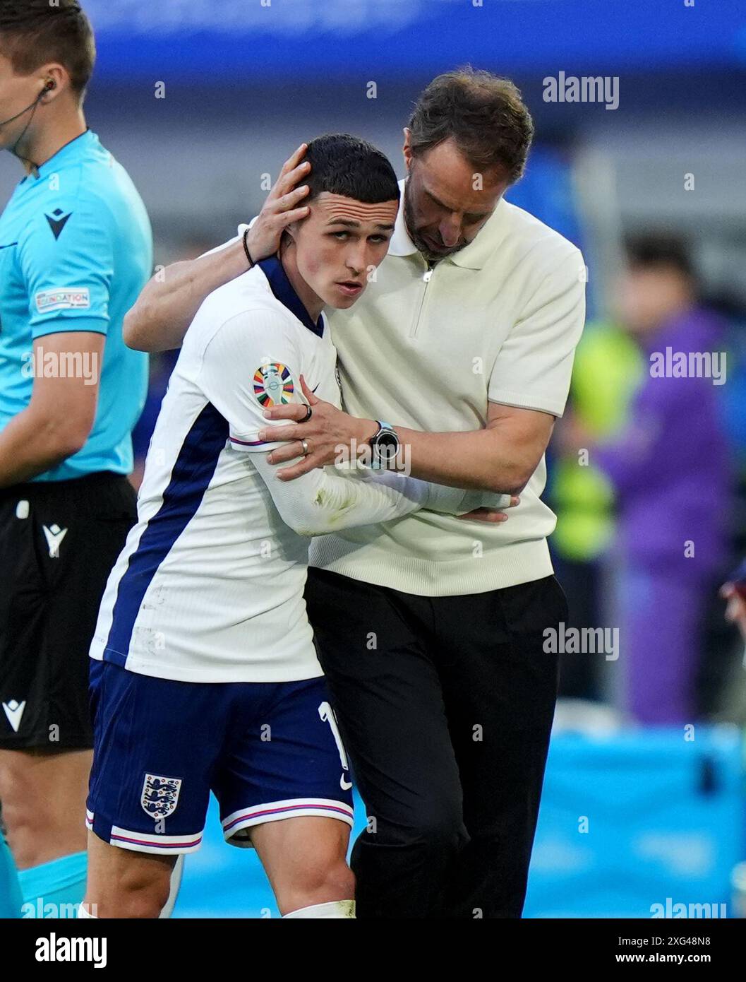 England's Phil Foden (left) is congratulated by his manager Gareth ...