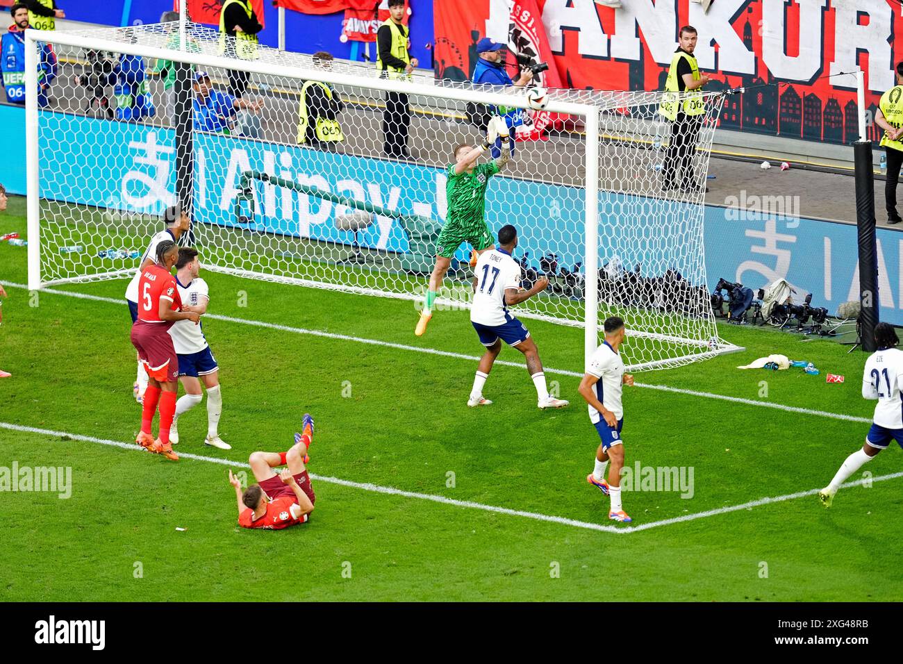 England goalkeeper Jordan Pickford attempts to save a shot from a ...