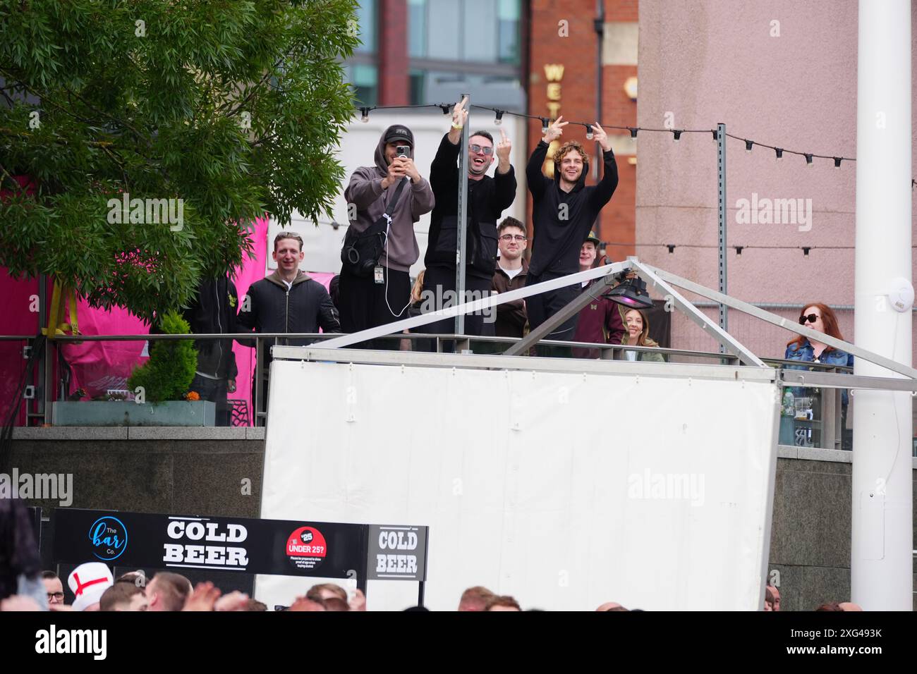 NOTE GESTURES Singer Tom Grennan (right) in Millennium Square in Leeds ...